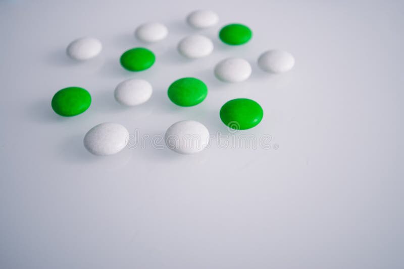 Tablets or Sweets, White and Colored on a White Table Stock Photo ...
