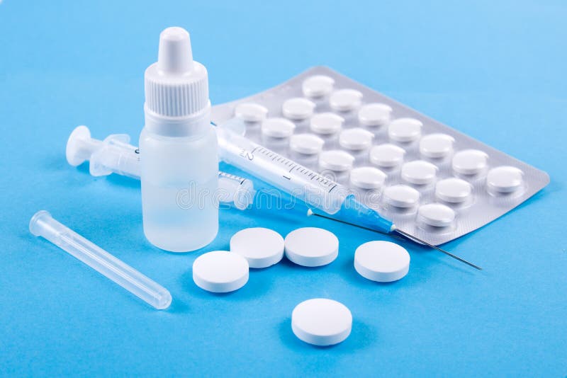 Tablets and syringes stock photo. Image of background - 14052012
