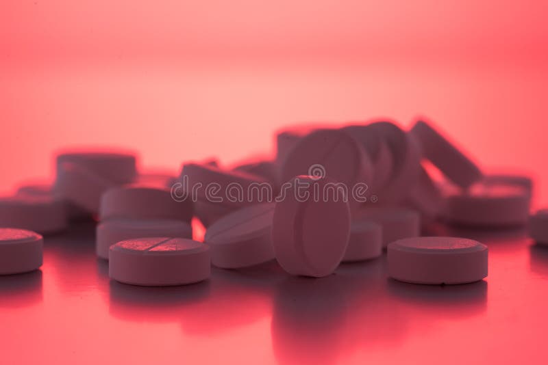 Tablets Under Red Light with the Effect of Danger. Stock Image - Image ...