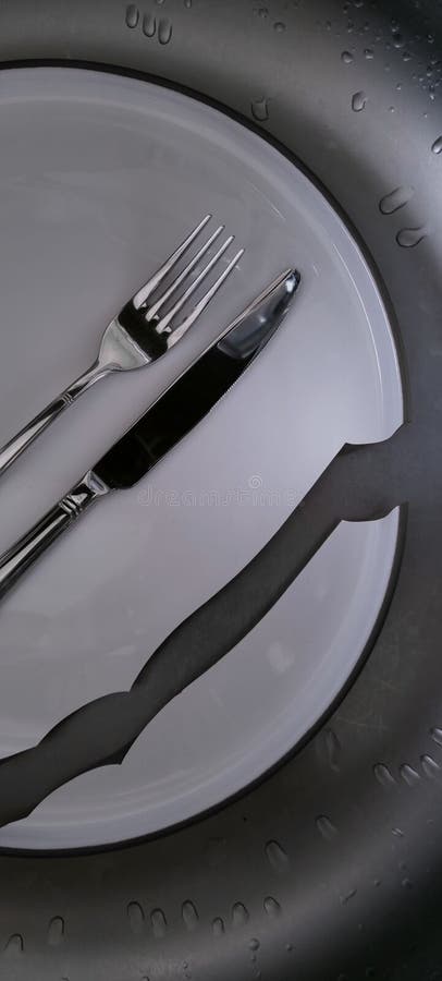 Tableware Lays Over the Broken Plate. Knife and Fork on the Dining ...