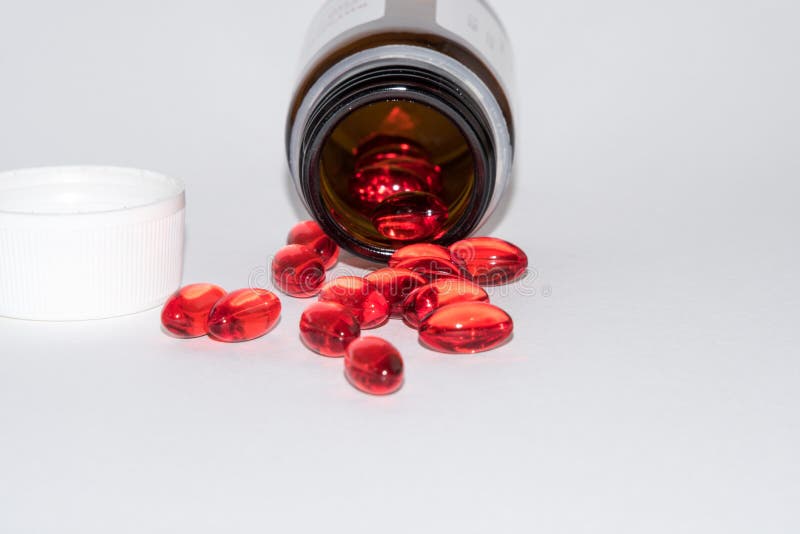 Tabs Vitamins, Omega 3, Medications Tablets and Capsules in a Beaker ...