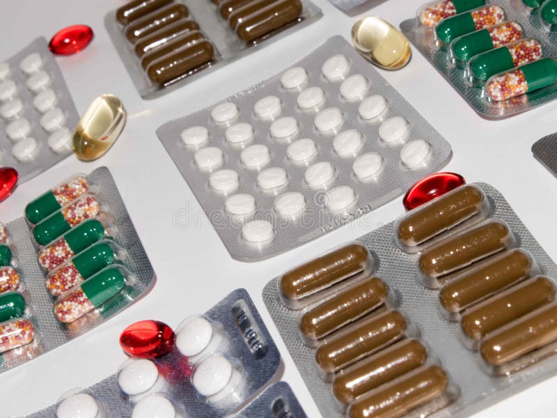 Tabs Vitamins, Omega 3, Medications Tablets and Capsules in a Beaker ...