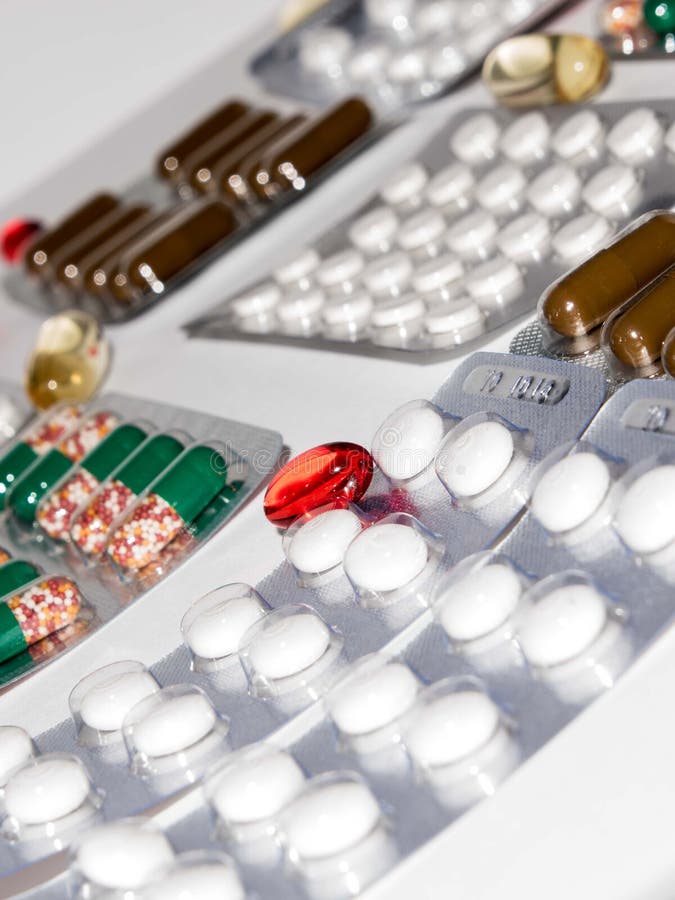 Tabs Vitamins, Omega 3, Medications Tablets and Capsules in a Beaker ...