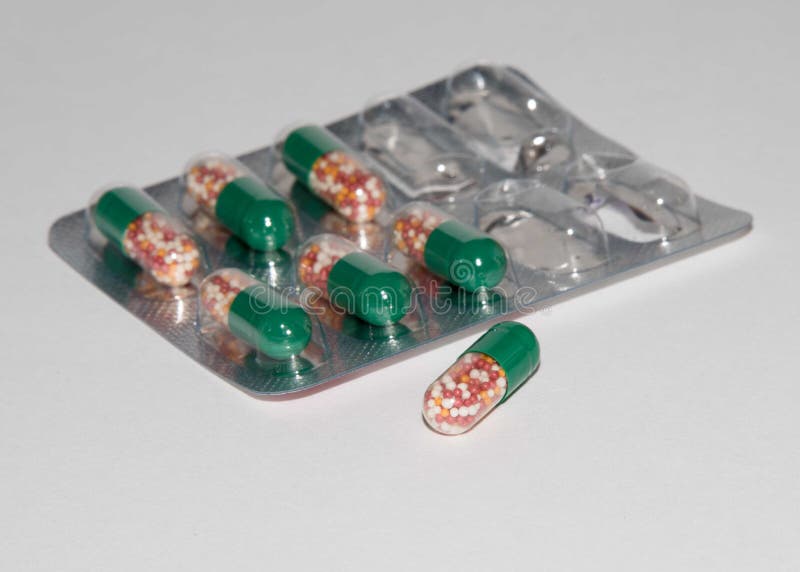 Tabs Vitamins, Omega 3, Medications Tablets and Capsules in a Beaker ...