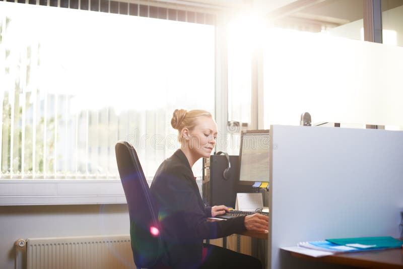 Tackling Her Work One Task at a Time. an Attractive Businesswoman Using ...