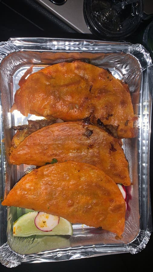 Tacos de birria in a Car stock photo. Image of lime - 358139106