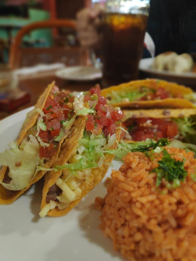 Two Tacos and Rice and Beans and Cheese on Plate Stock Image - Image of ...