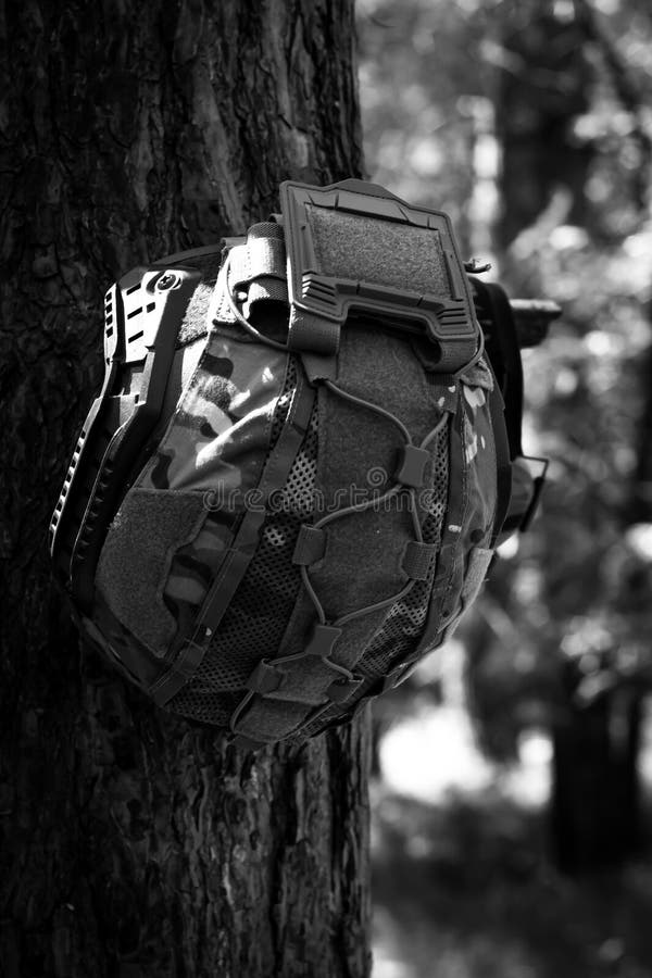 Ilitary Tactical Helmet with a Camouflage Pattern Hangs from a Tree ...