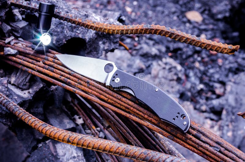 Tactical Knife and Flashlight. a Bright Flare from the Lantern Stock ...