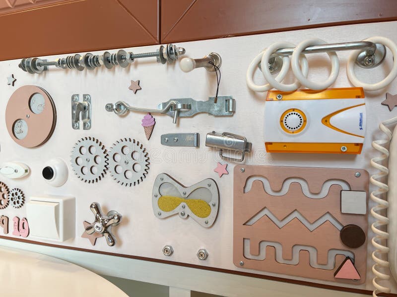 Tactile Busy Board with Buttons and Gears for Children Stock Photo ...