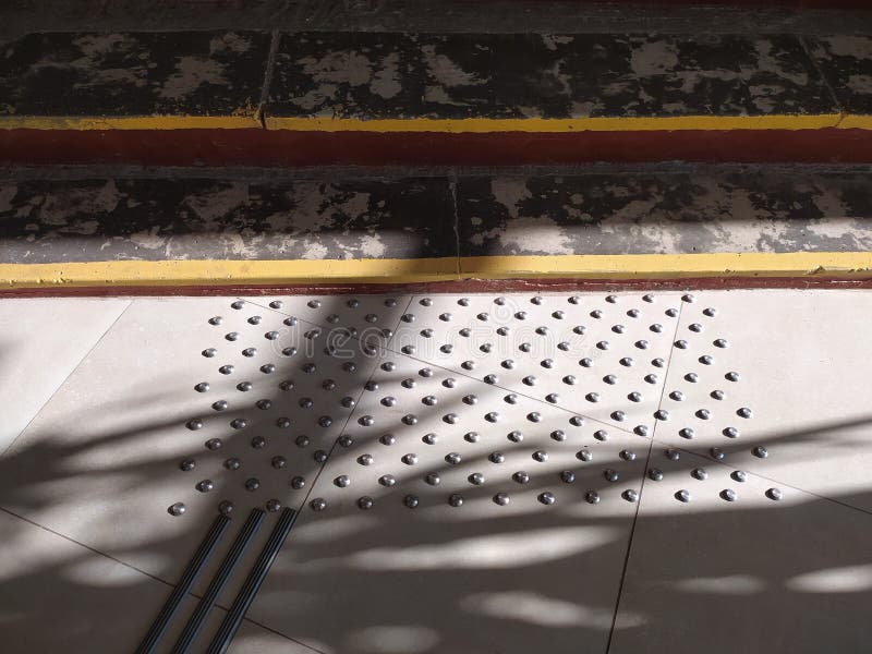 Tactile Tiles with Raised Elements for Visually Impaired People on the ...