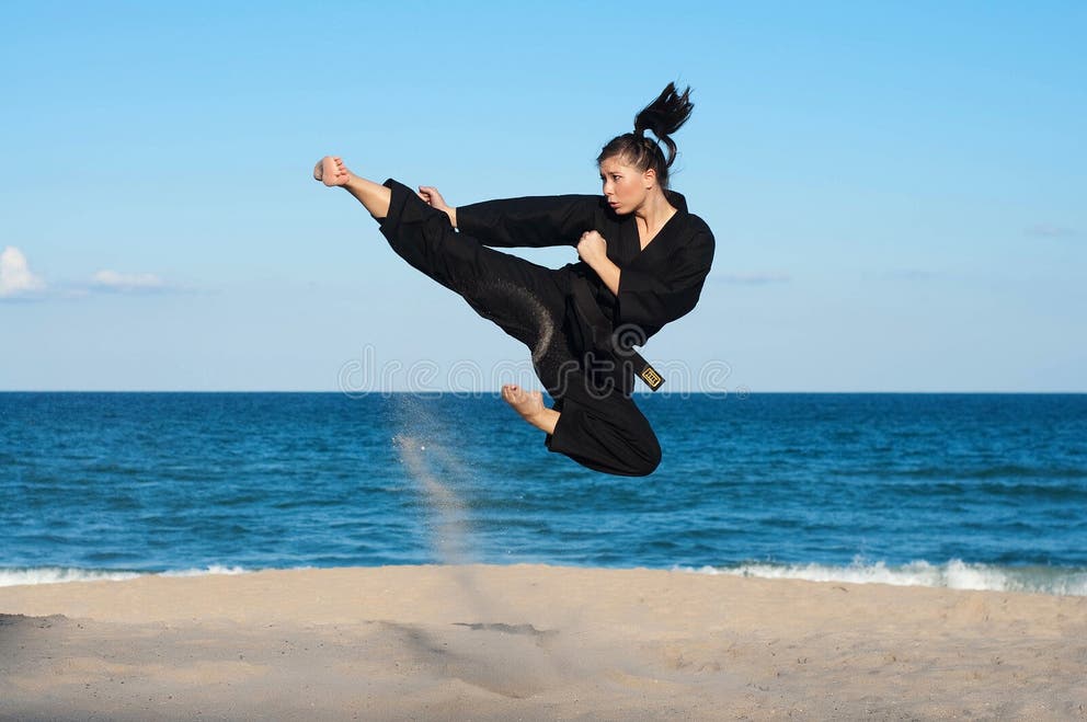 Taekwondo Kick at Beach stock photo. Image of degree - 26436538