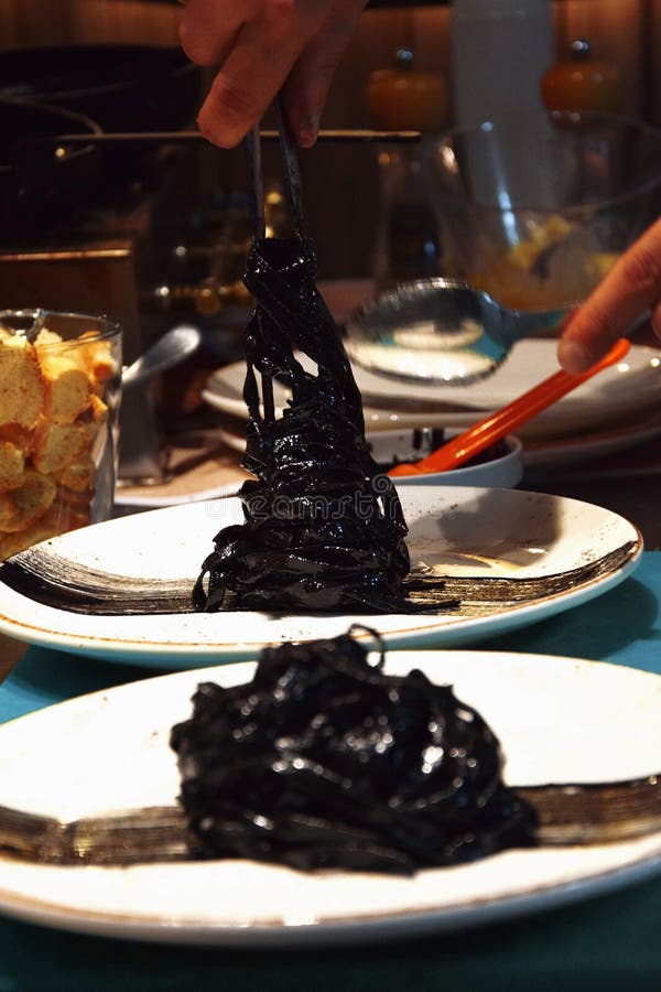Tagliatelle on Cuttlefish Ink, with a Unique Black Caesar`s Stock Image ...