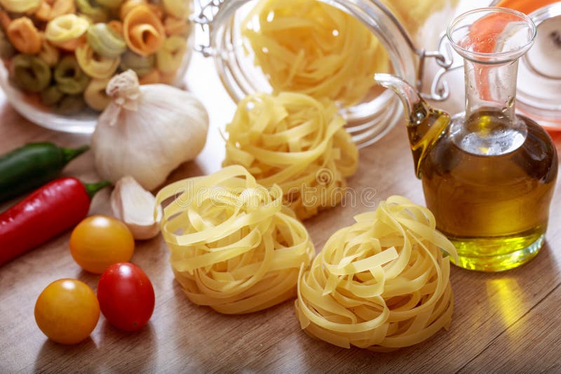 Tagliatelle Pasta on a Table Stock Photo - Image of cherry, chilli ...