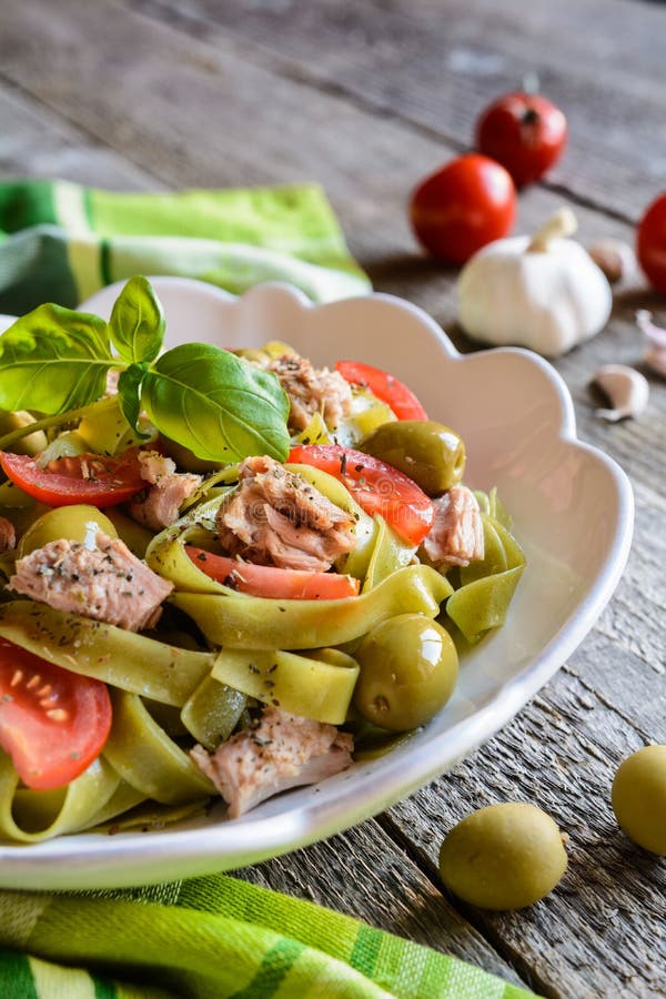 Tagliatelle Pasta with Tuna Fish, Tomato and Olives Stock Photo - Image ...
