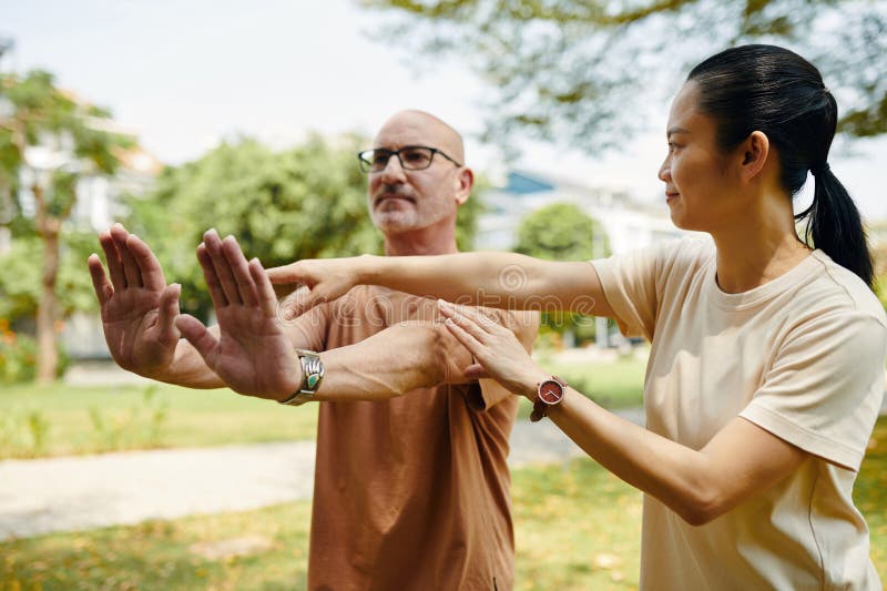 Tai Chi Instructor Working with Client Stock Photo - Image of harmony ...