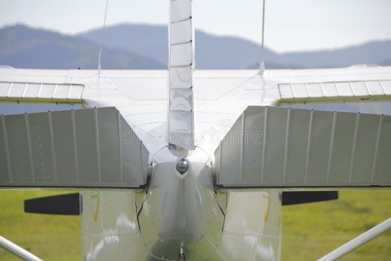 The Engine of a Plane at Flight with Brilliant Clouds and Mountains of ...