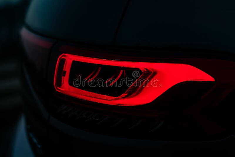 The Tail Lights on a Small Car are Red Light at Night Stock Photo ...