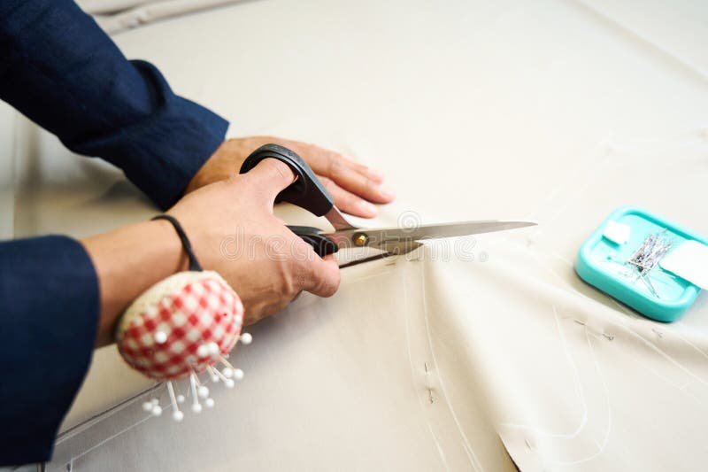 Tailor Cutting Fabric with Pair of Scissors on Table Stock Image ...