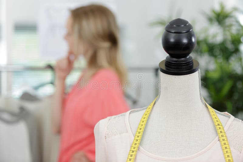 Tailor Dummy with Measuring Tapes in Fashion Studio Stock Image - Image ...