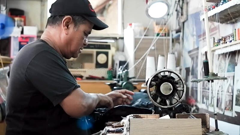 A Tailor is Fixing a Broken Bag Stock Video - Video of person, factory ...