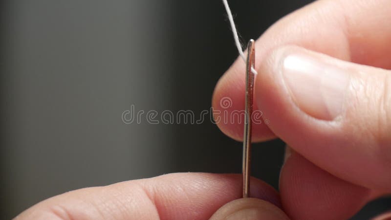 Tailor Hand Inserting Sewing Thread in Needle Hole. Man Preparing ...