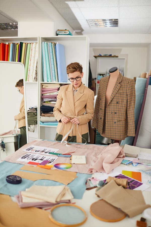 Tailor making new clothes stock photo. Image of modern - 182756328