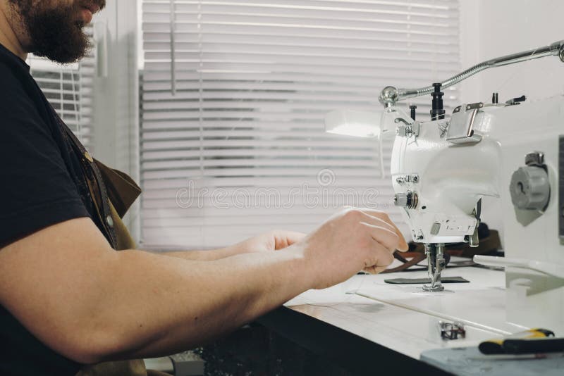Tailor Man Sewing at Workplace. Man Hands Sewing on Machine, Close-up ...