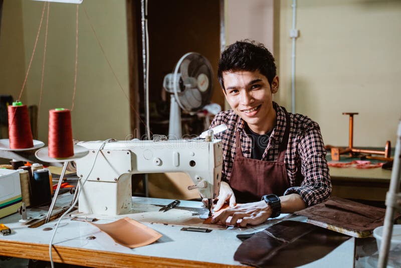 Tailor Man Smiling while Using a Sewing Machine Stock Image - Image of ...