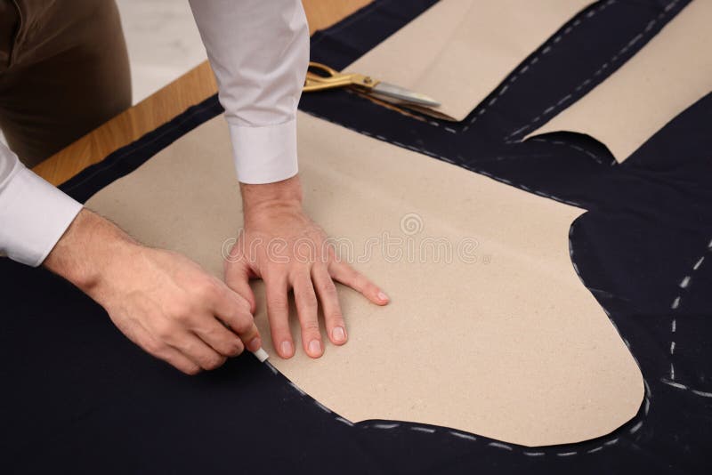 Tailor Marking Sewing Pattern on Fabric with Chalk at Table, Closeup ...