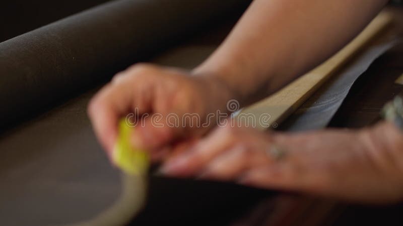 Tailor Pointing a Line To Cut a Hard Fabric To Make a Bag Stock Footage ...