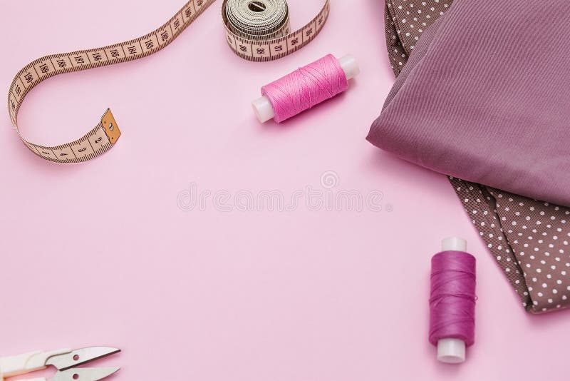 Pink Background with Sewing Accessories and Fabric. Sewing Threads ...