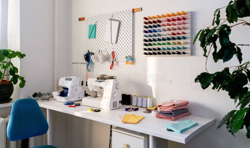 A Tailor S Workspace in a Spacious White Room. Large White Table with ...