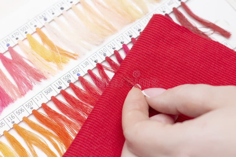 Tailor Selects the Color of the Thread in the Catalog for the Red ...
