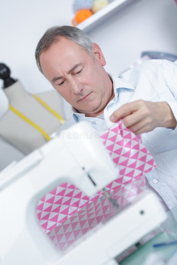 Tailor with sewing machine stock photo. Image of tape - 230652706