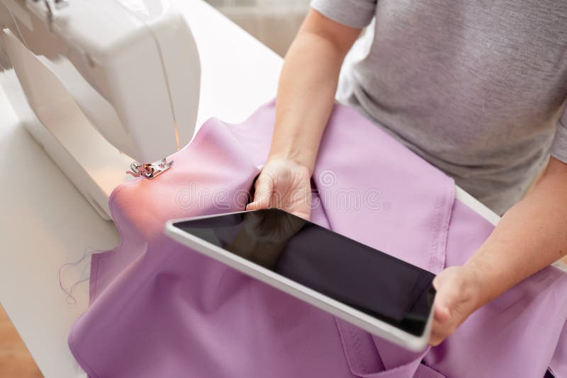 Tailor with Sewing Machine, Tablet Pc and Fabric Stock Photo - Image of ...