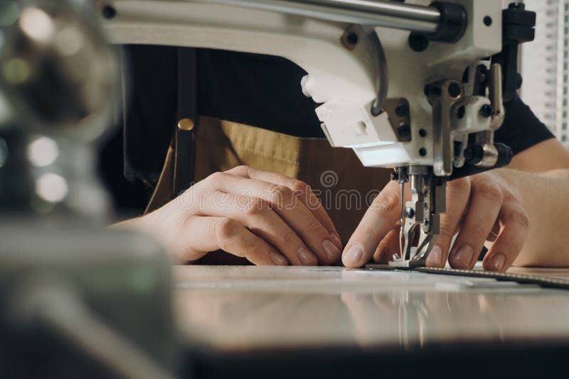Tailor Man Sewing at Workplace. Man Hands Sewing on Machine, Close-up ...