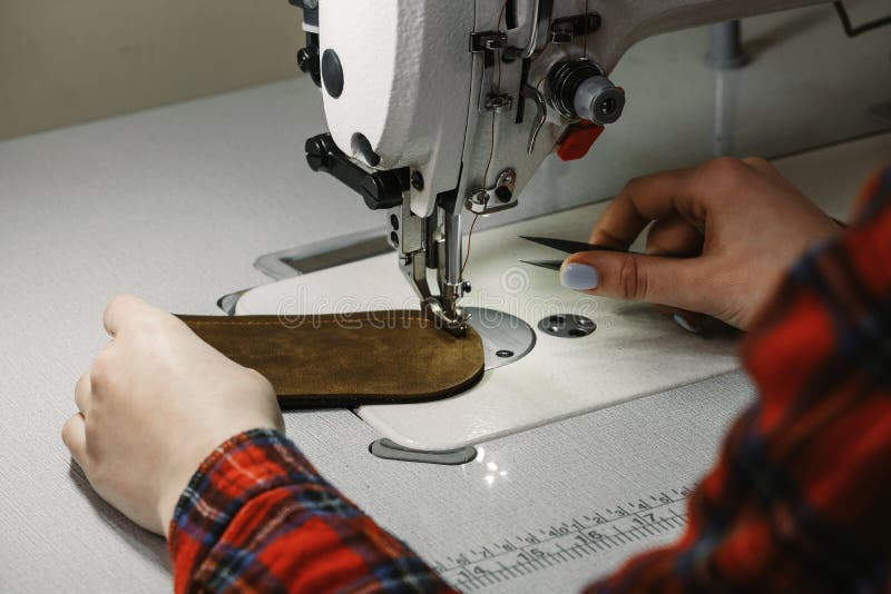 Tailor Sewing at Workplace. Woman Hands Sewing on Machine, Close-up ...