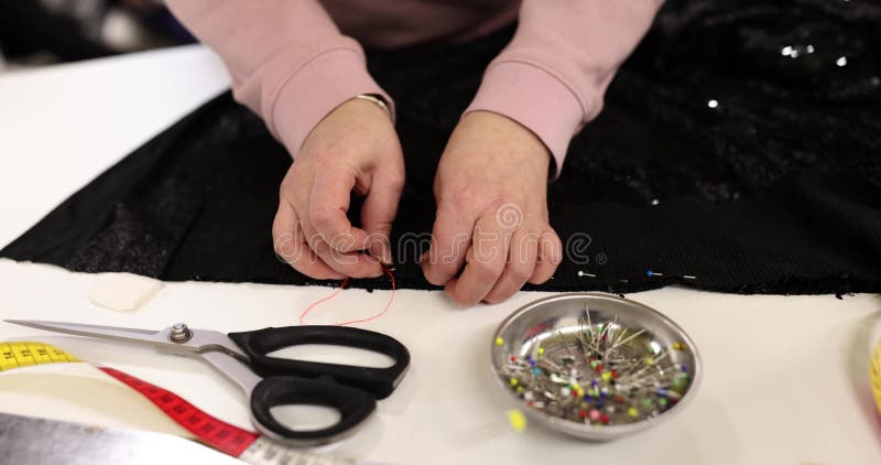 Tailor Sews Fabric with Thread and Needle To Create Clothes Stock ...