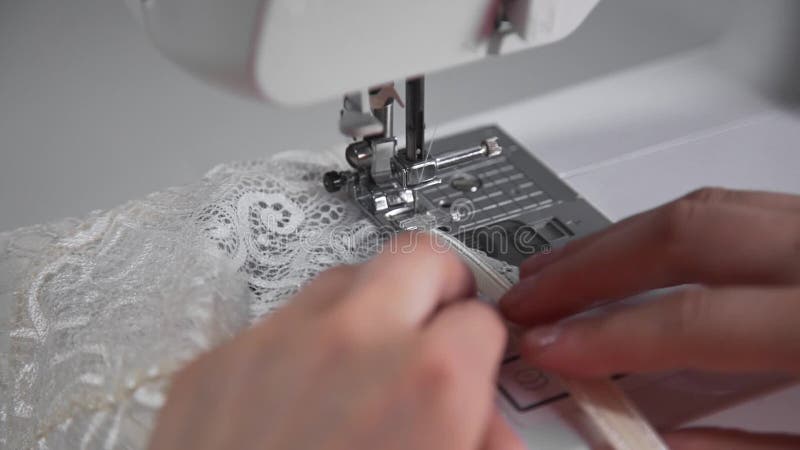 Tailor Sews Lingerie on a Sewing Machine, Thread and Lace, Handmade ...