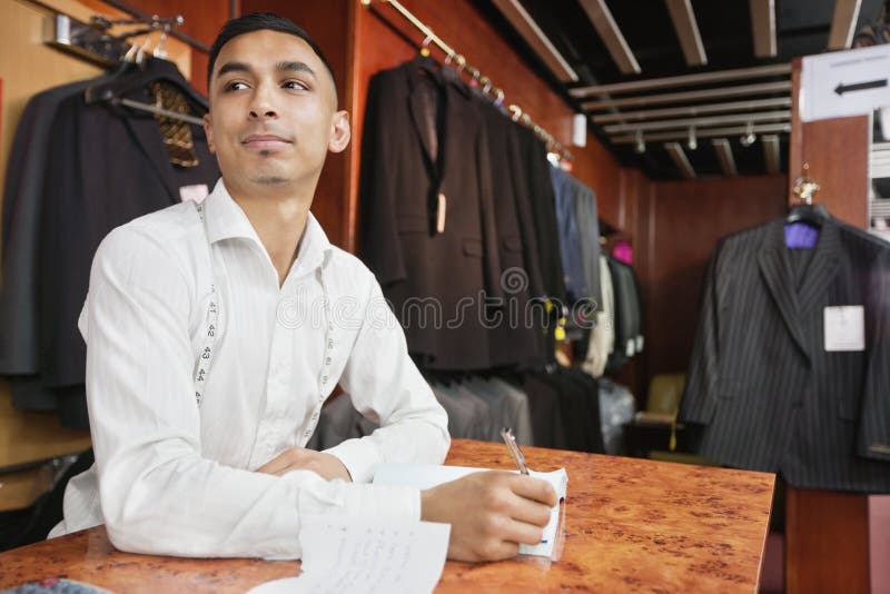 Tailor Standing by the Desk Looking Away Stock Photo - Image of ...