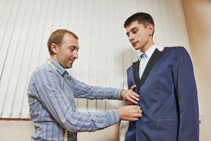 Tailor suit fitting stock photo. Image of alterations - 46593120