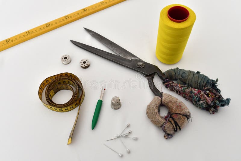 Tailor`s Instruments. the Marker and Scissors with Cloth in Background ...
