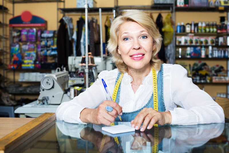 Tailor Taking Order at Counter Stock Image - Image of writing, tape ...