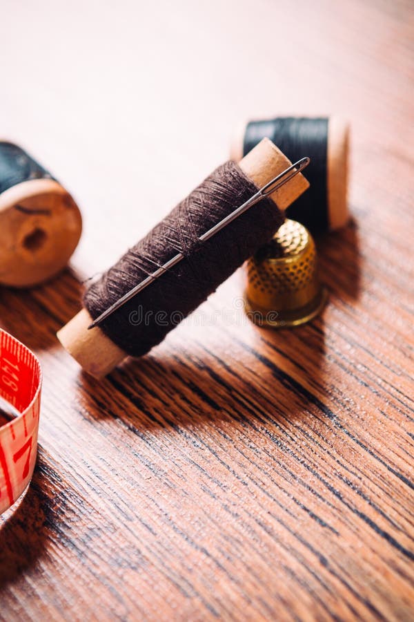 Lot Vintage Spools of Thread Thimble and Measuring Tape on a Woo Stock ...