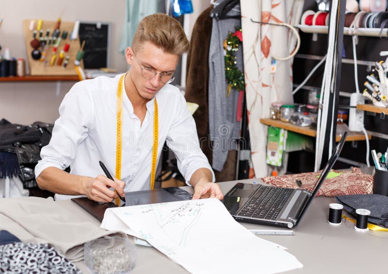 Tailor Using Laptop and Graphics Tablet Stock Photo - Image of garment ...