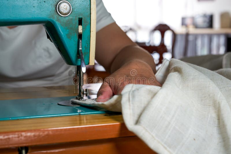 A Tailor Using a Traditional Household Sewing Machine Stock Photo ...