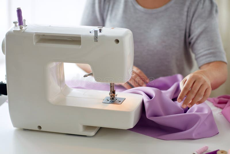 Tailor Woman with Sewing Machine Stitching Fabric Stock Photo - Image ...