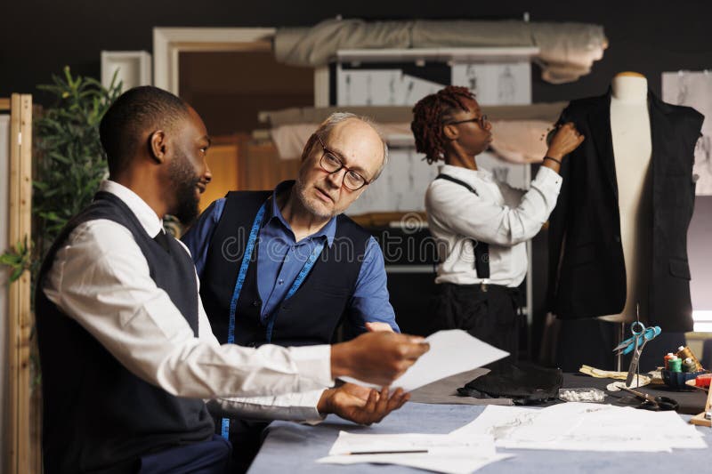 Tailor Working with Diverse Apprentices Stock Image - Image of textile ...