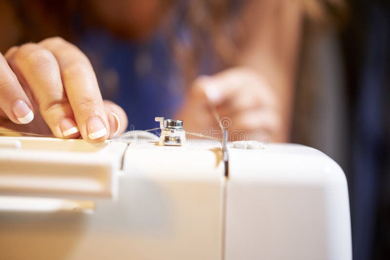 Working on sewing machine stock photo. Image of design - 42488638
